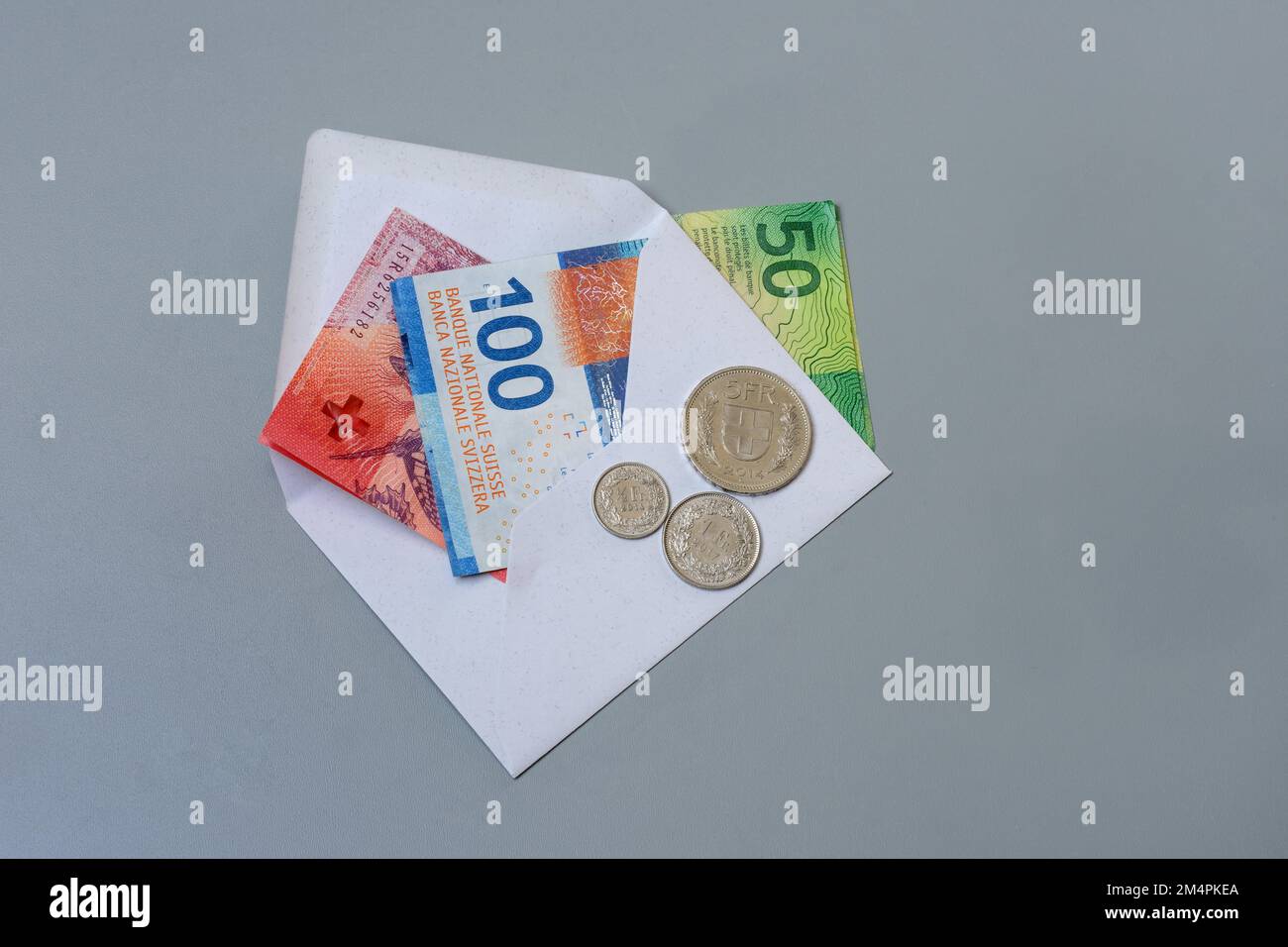 Swiss banknotes with envelope, money gift, symbol photo Stock Photo - Alamy