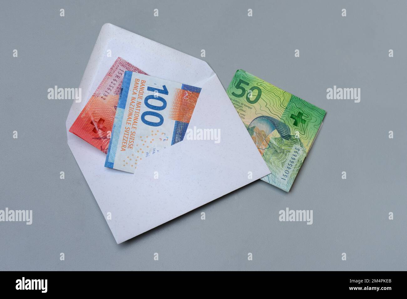 Swiss banknotes with envelope, money gift, symbol photo Stock Photo - Alamy