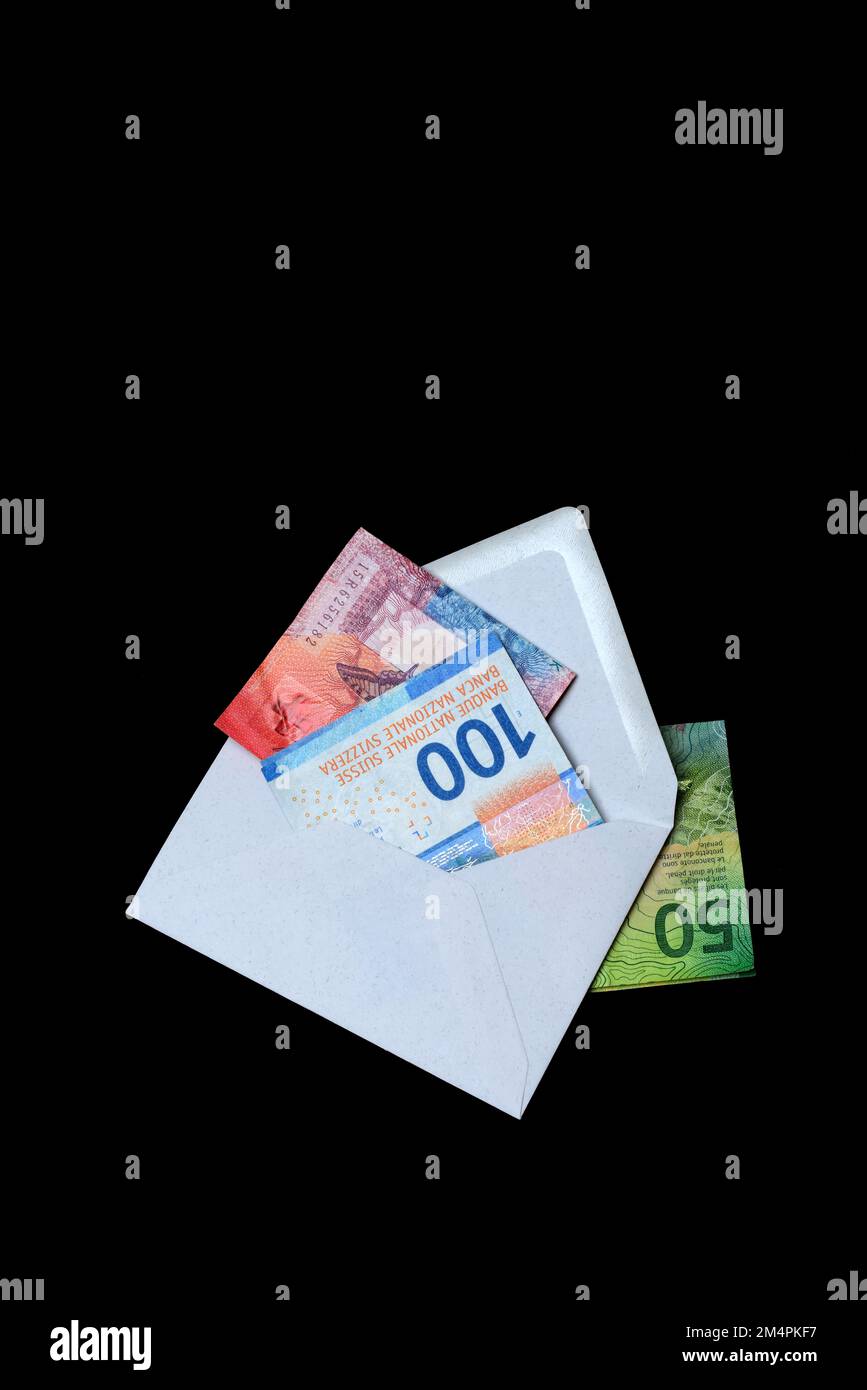Swiss banknotes with envelope, money gift, symbol photo Stock Photo - Alamy