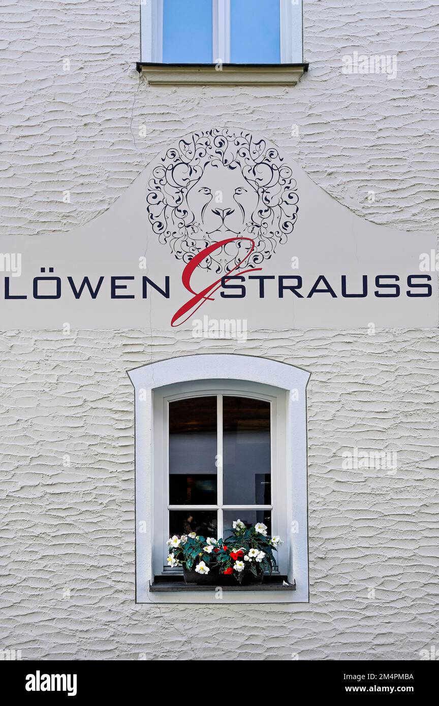 Facade with window and logo of Loewen und Strauss Wirtschaft ...