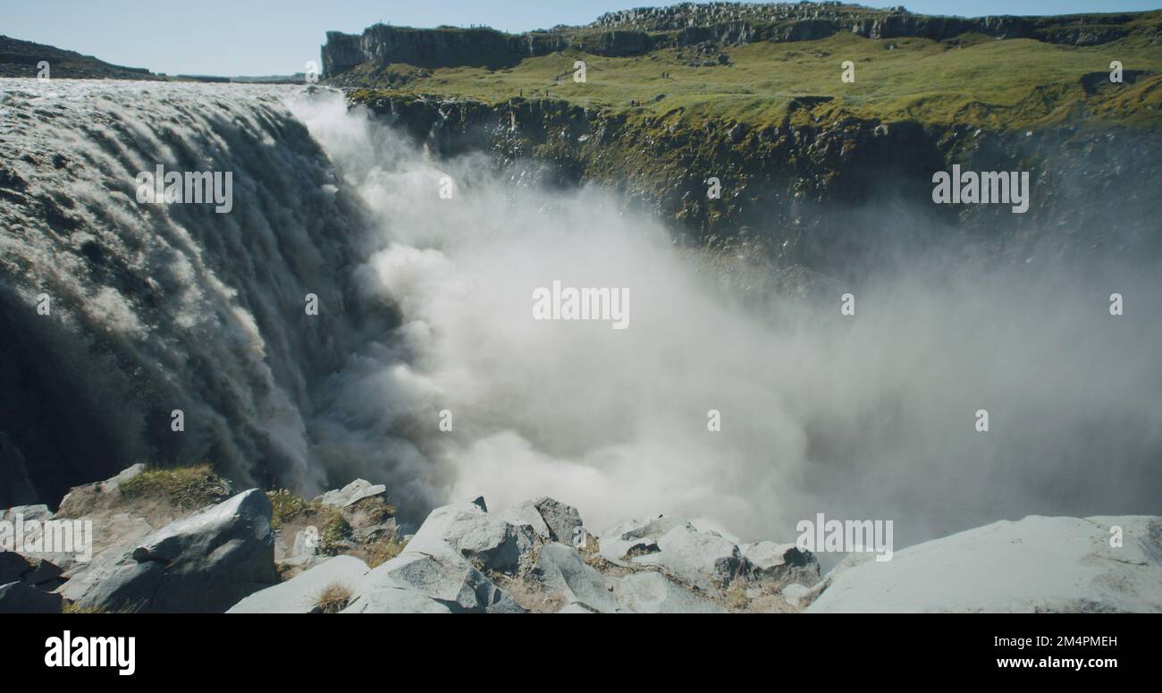 Impressive powerful Dettifoss waterfall with cliff edge in foreground ...