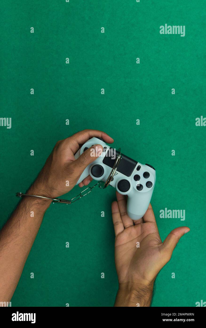 Video game joystick and handcuffs isolated. Addiction to games concept ...