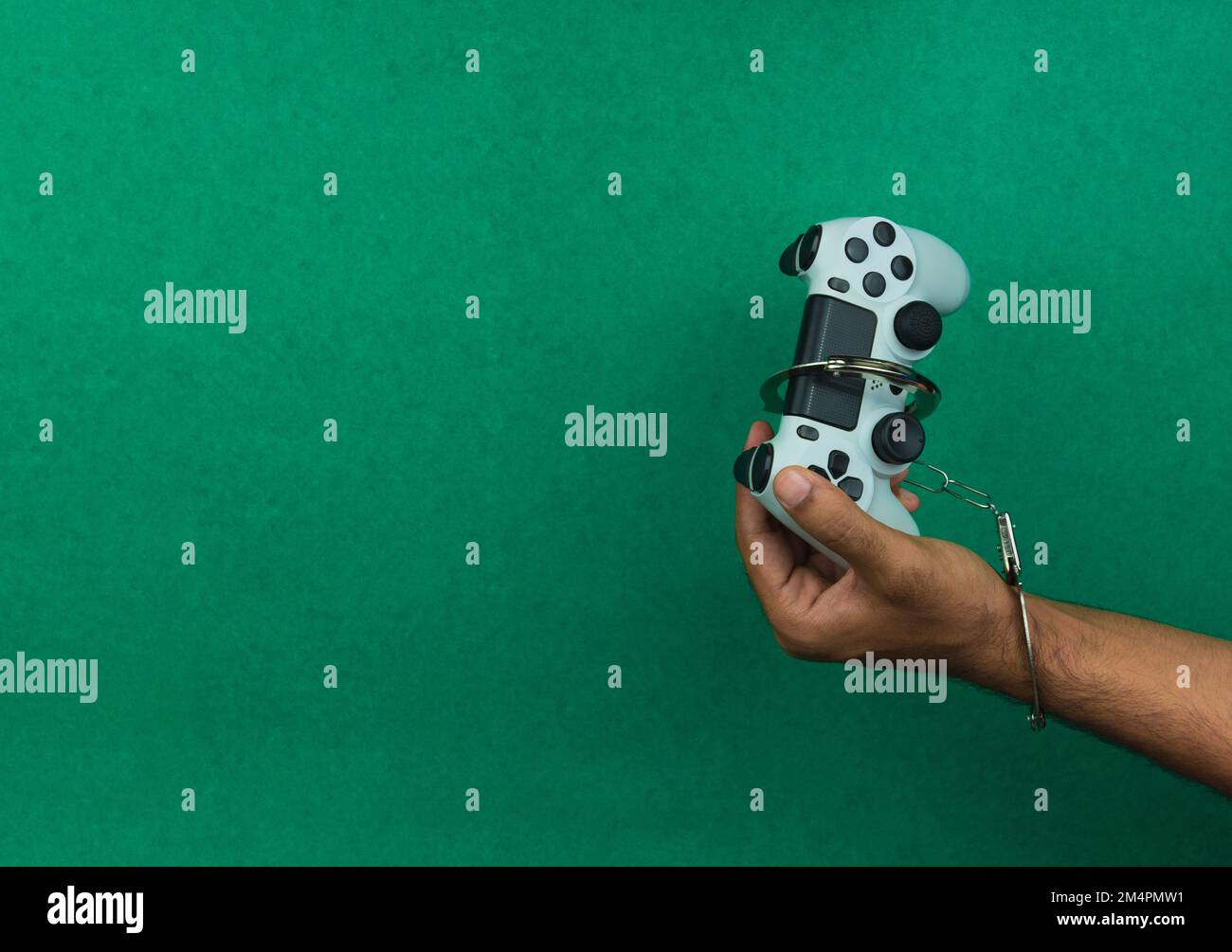Video game joystick and handcuffs isolated. Addiction to games concept ...