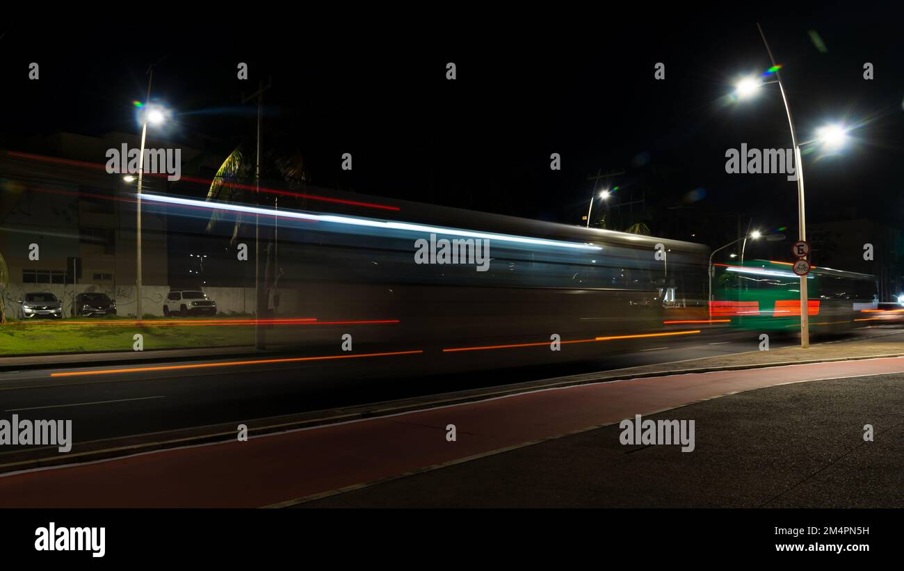 Colorful light trails with motion blur effect of a bus, long exposure ...