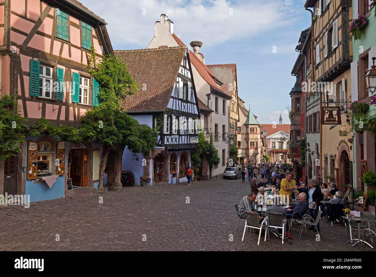 Colourful half-timbered houses in the historic old town of Riquewihr ...
