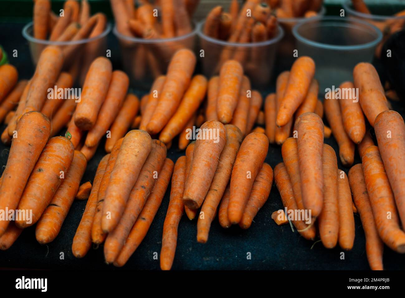 Stacked carrots. Ready for sale. Organic concept Stock Photo - Alamy
