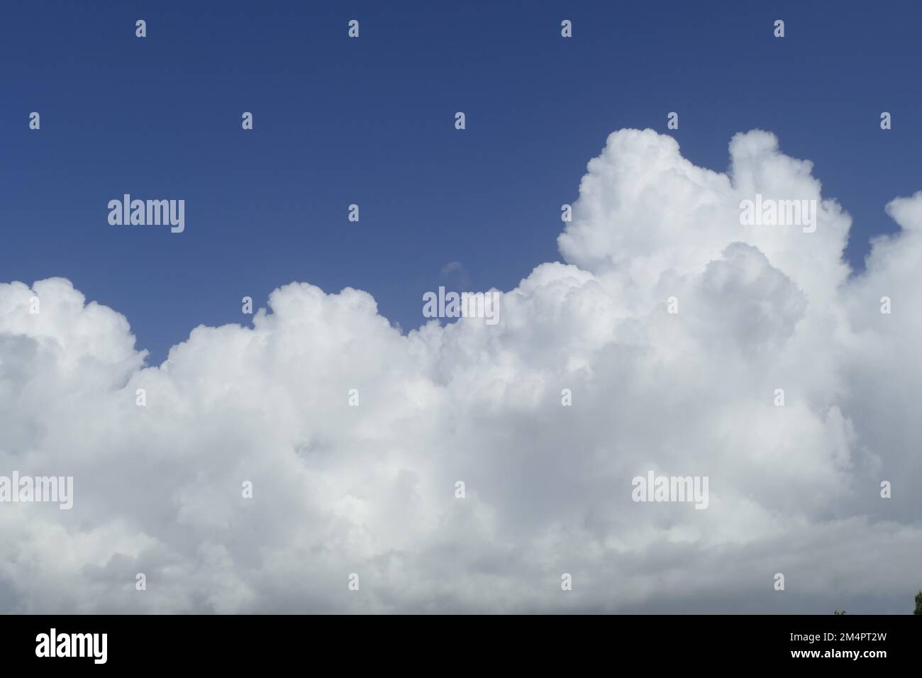 White spring clouds, blue sky, Germany Stock Photo - Alamy