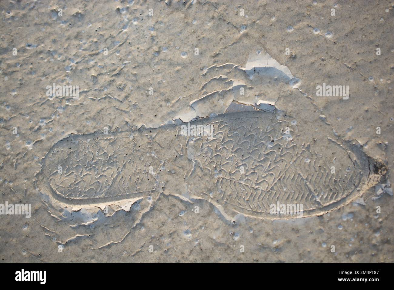 Footstep pattern seen on a concrete background Stock Photo - Alamy