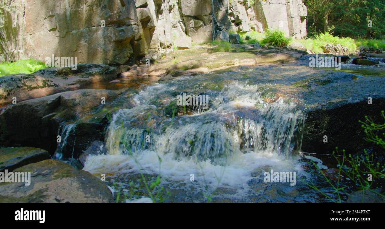 Mountain fast river, rapid current of waterfall on a sunny summer day ...