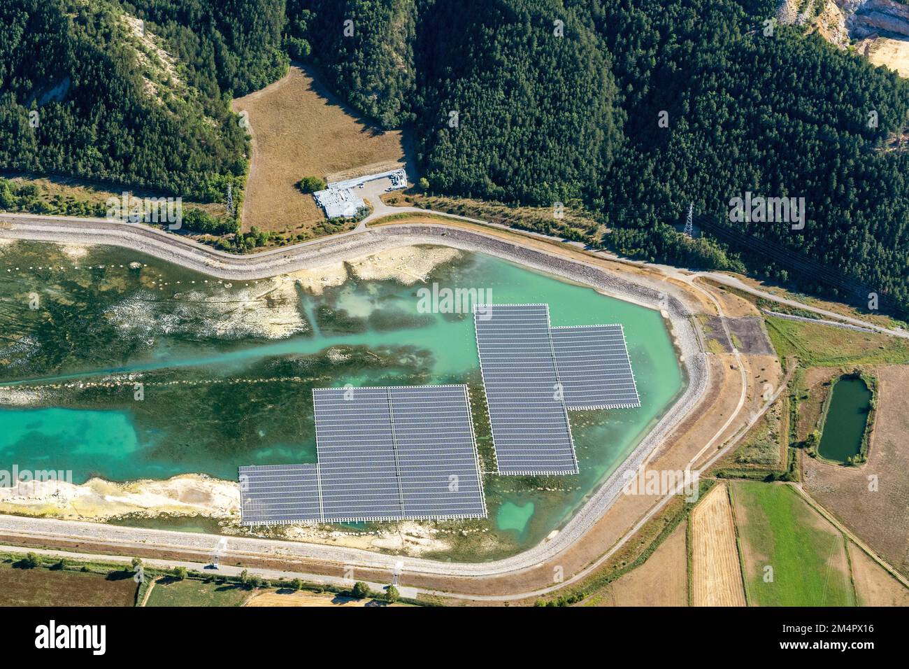 Aerial photo photovoltaics on a water retention basin in the French ...