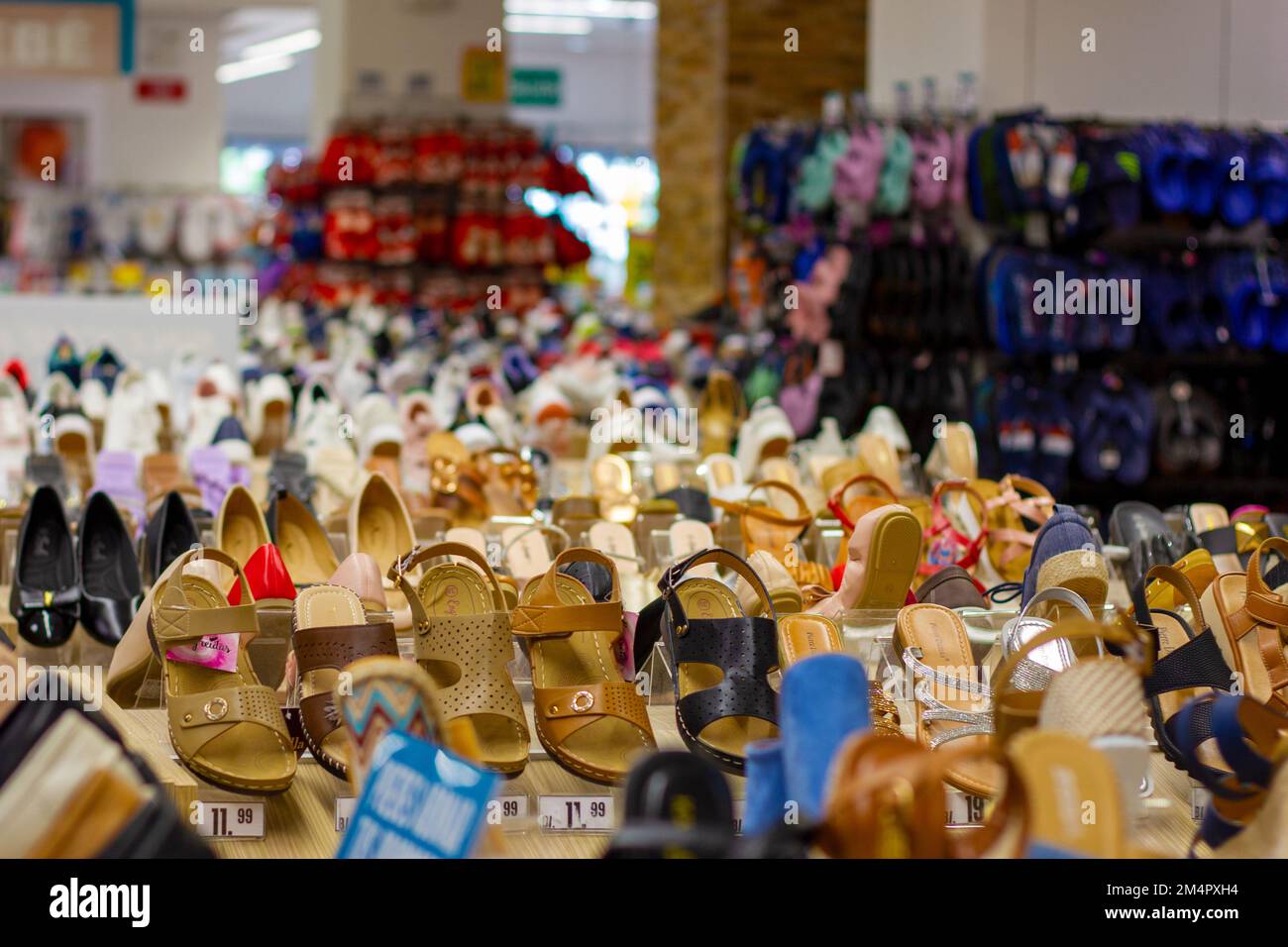 variety of women's shoes on store shelves Stock Photo - Alamy