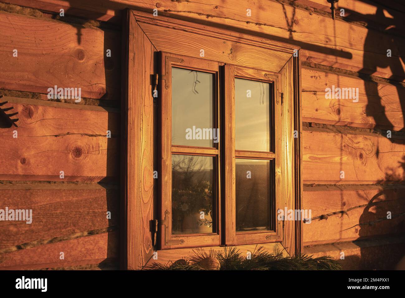 Window of a log house in early morning.Winter season. High quality ...