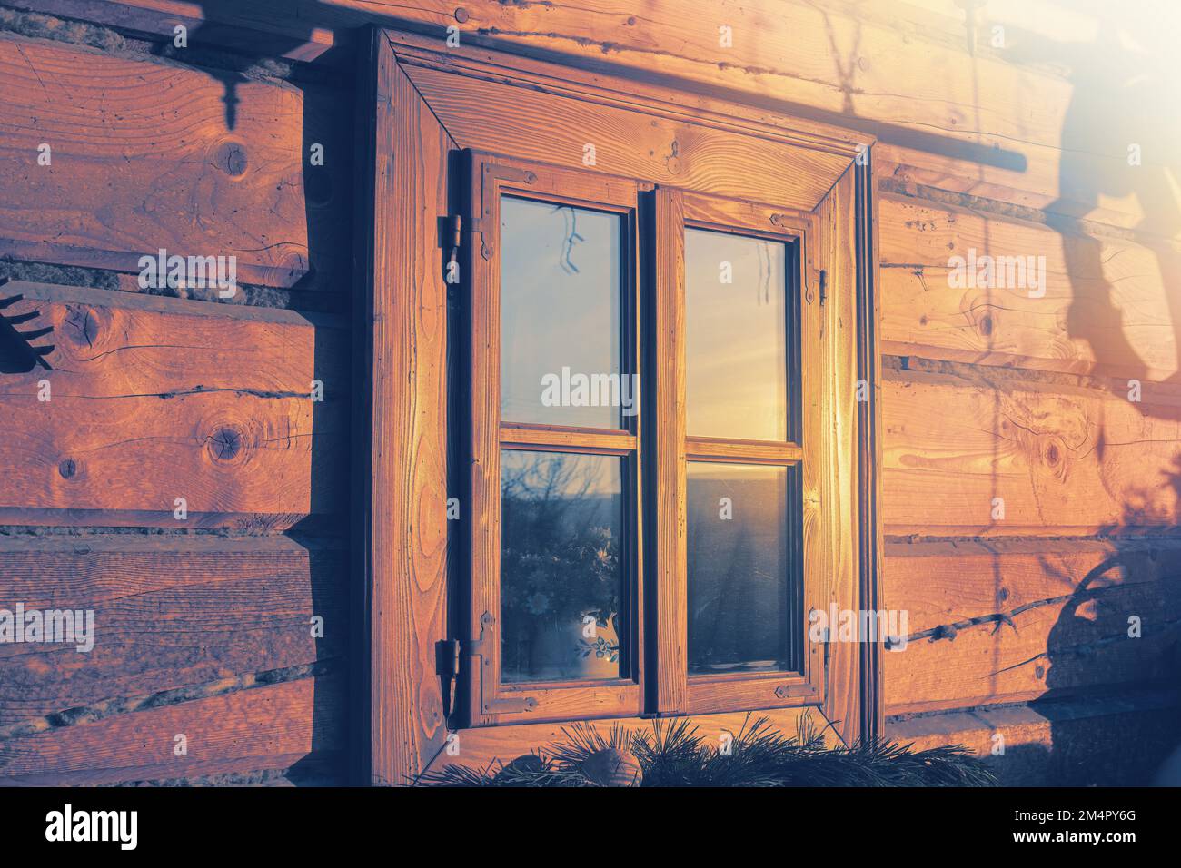 Window of a log house in early morning.Winter season. High quality ...