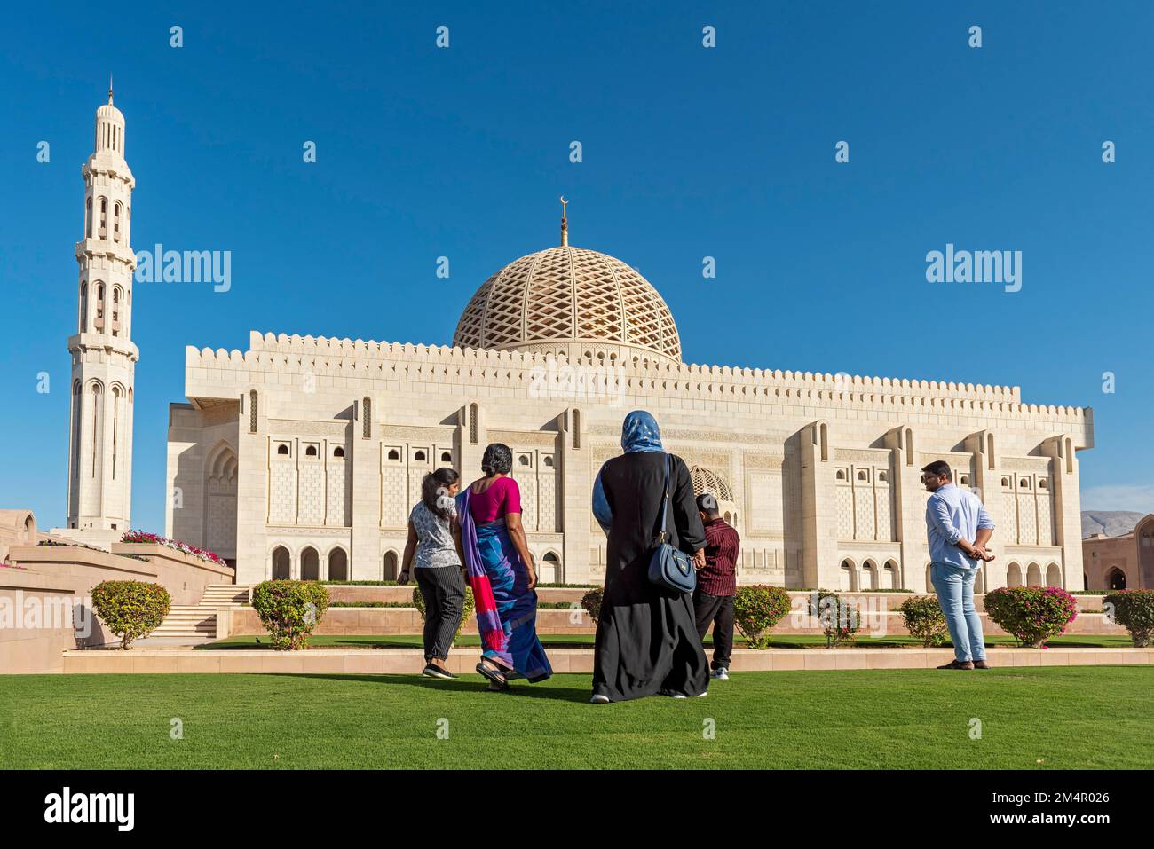 Indian family visiting Sultan Qaboos Grand Mosque, Muscat, Oman Stock ...