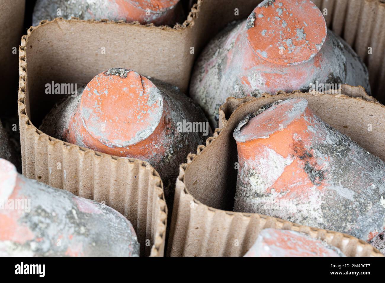Old, used and weathered clay flower pots are separated from each other ...