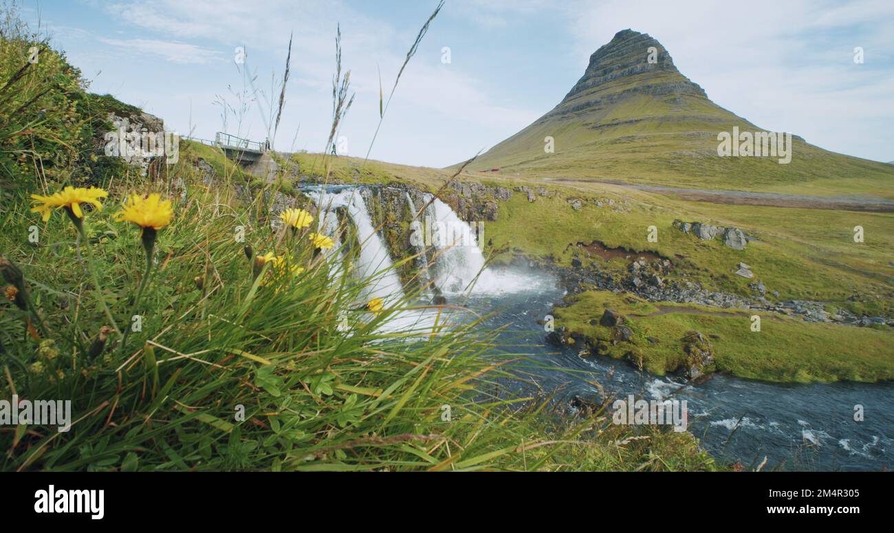Green mountain peak and Kirkjufellsfoss fall is popular attractions at ...