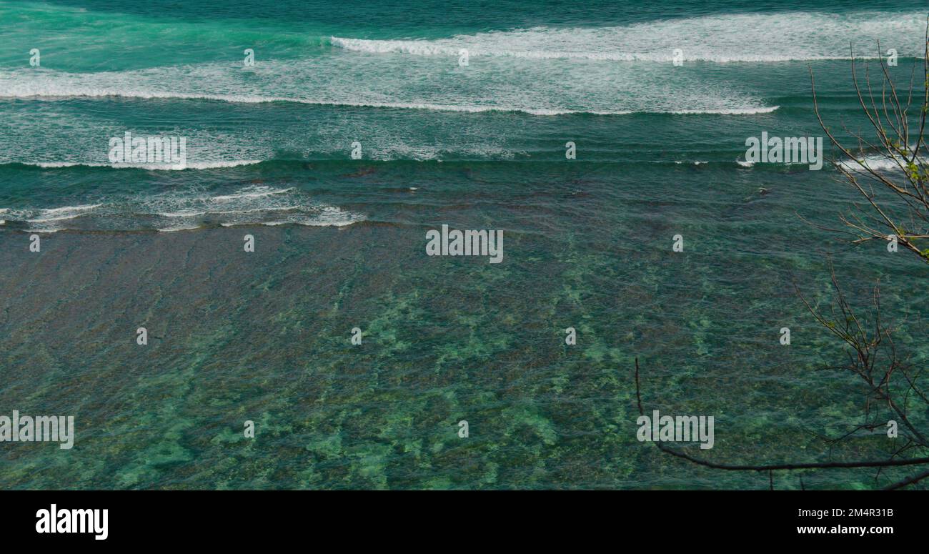 Azure pure turquoise ocean sea blue water waves foam on tropical Green ...