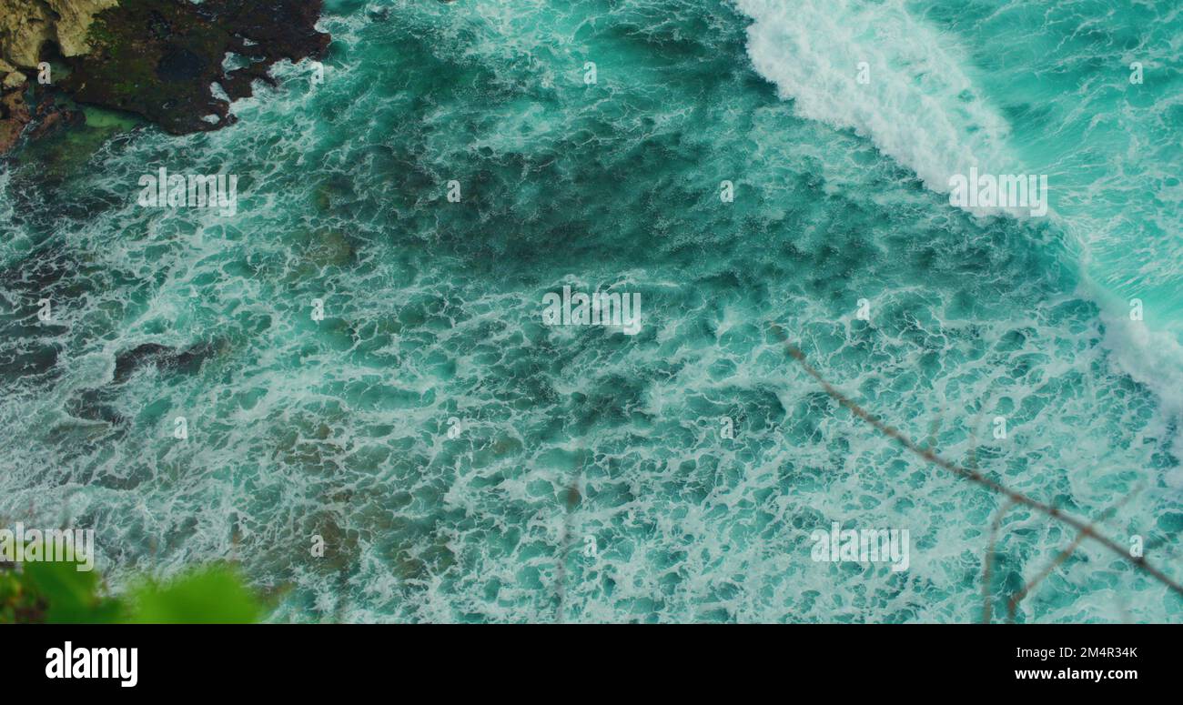 Ocean power beach surf clear water wide sea wave with white foam splash ...