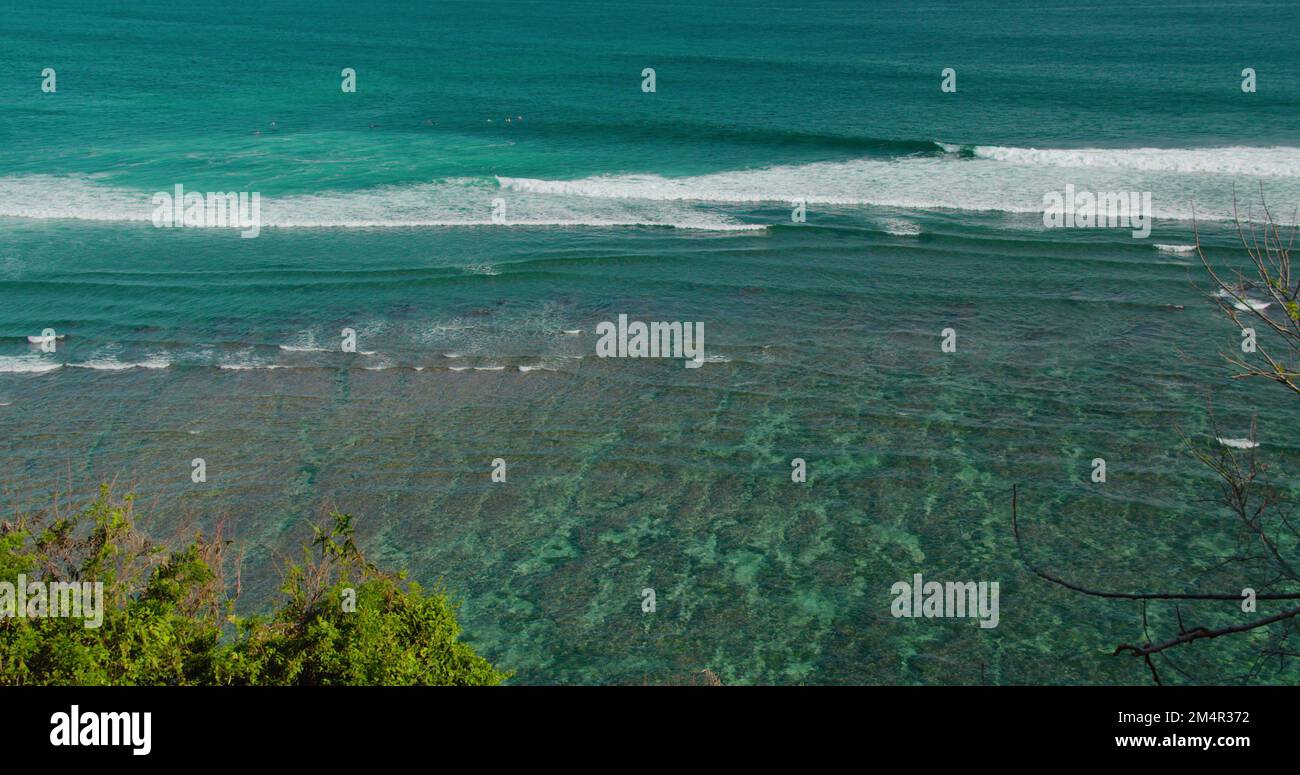 Static shot of azure pure turquoise ocean sea blue water waves foam on ...