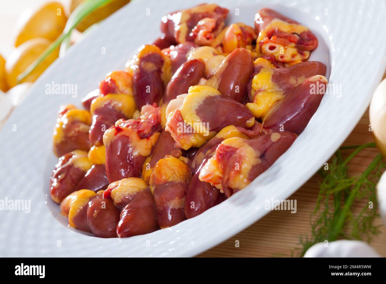 Closeup of fresh raw chicken hearts Stock Photo - Alamy