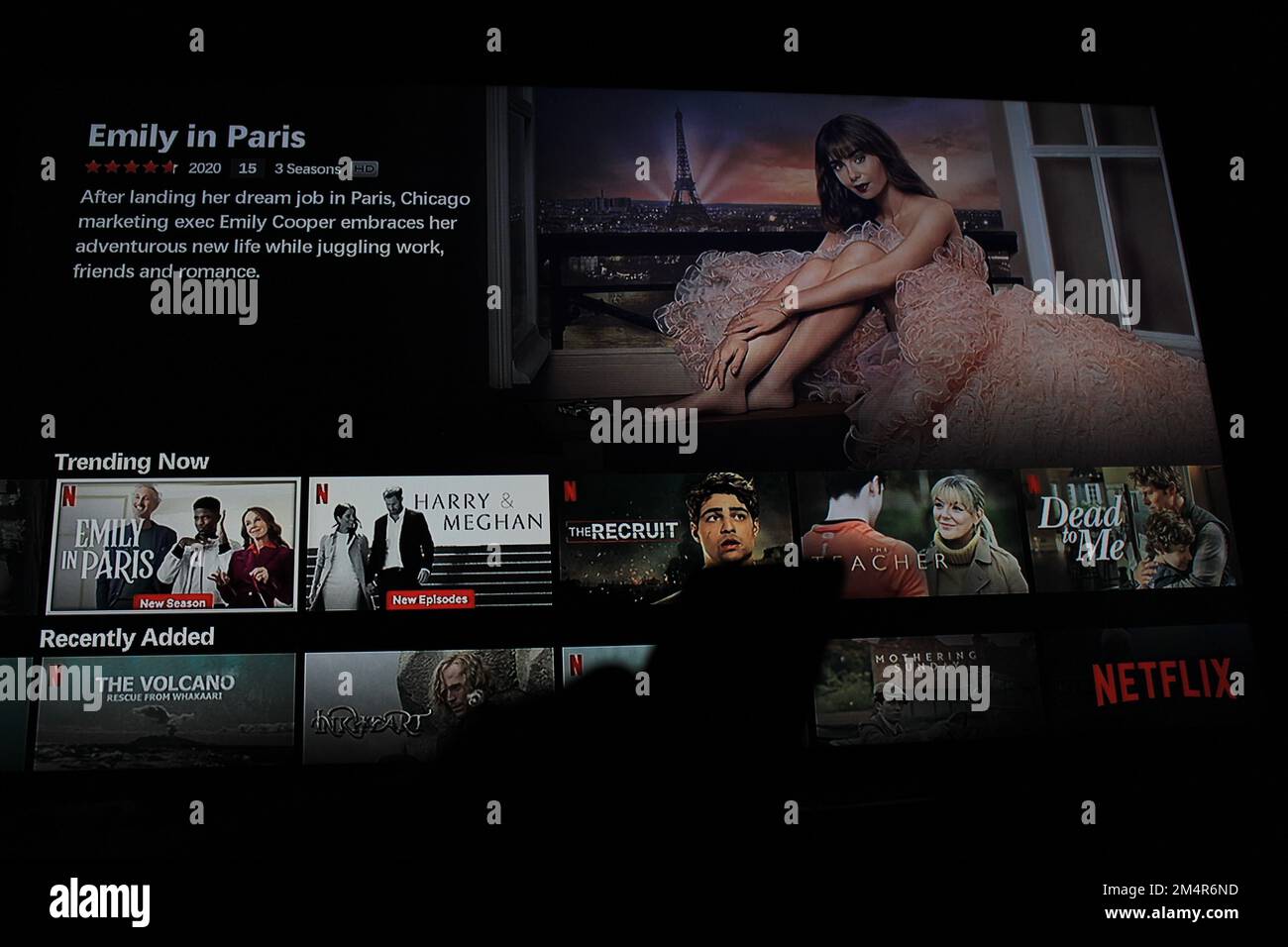 Netflix app on tv screen highlighting the television show Emily in ...