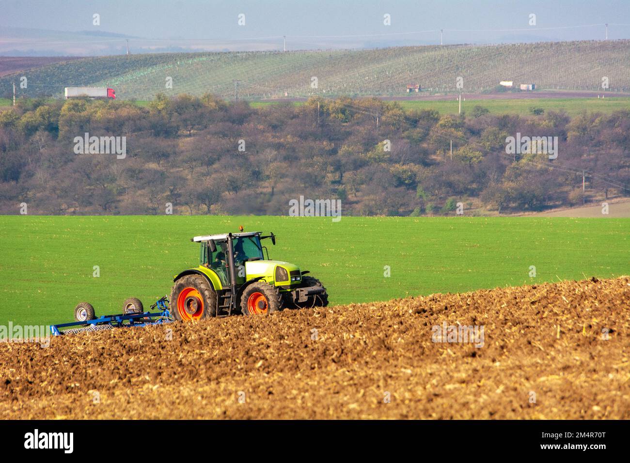 The tractor works the land. Claas Ares 836 RZ Stock Photo - Alamy