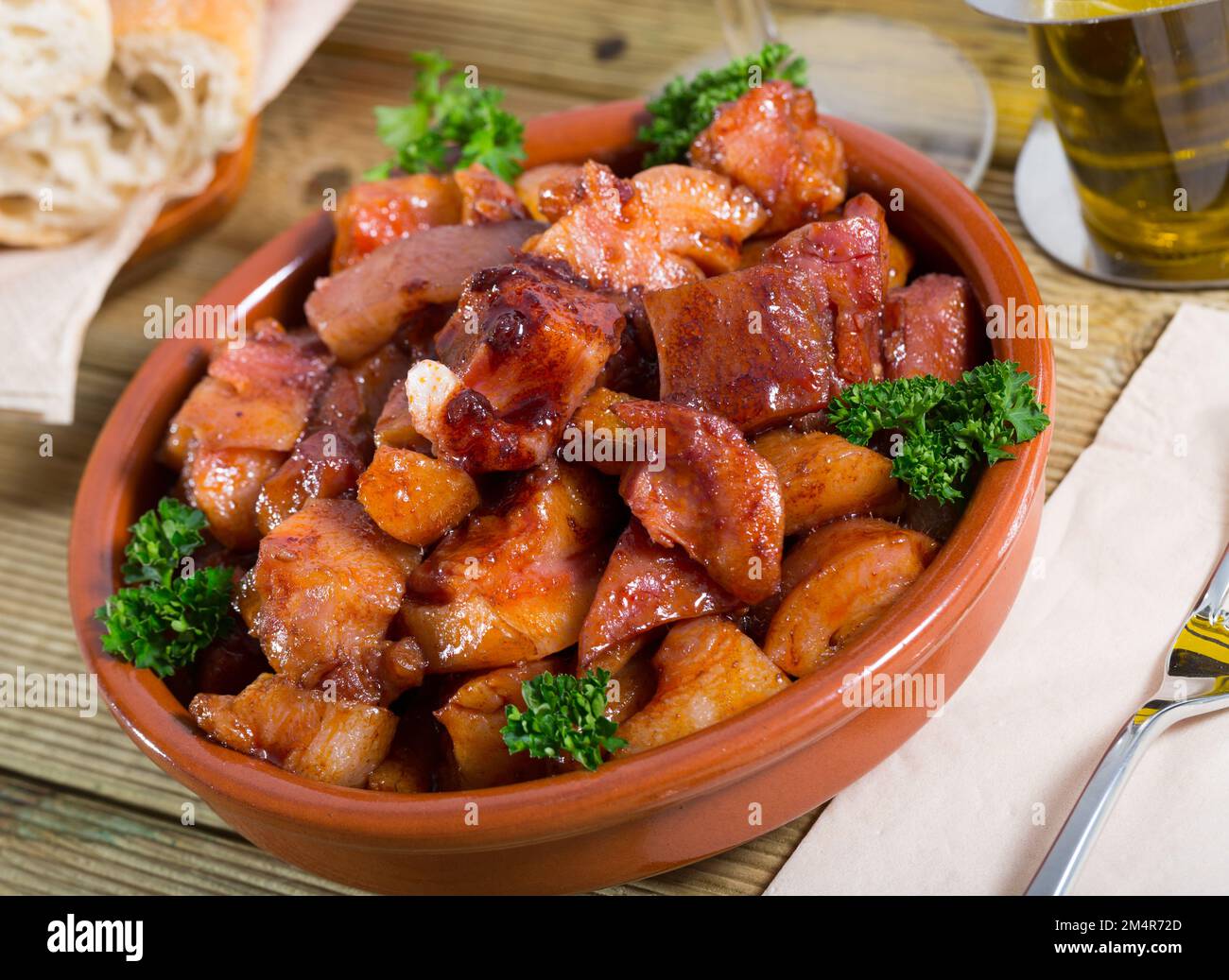 Spanish dish - roasted pig nose and cheeks Stock Photo - Alamy