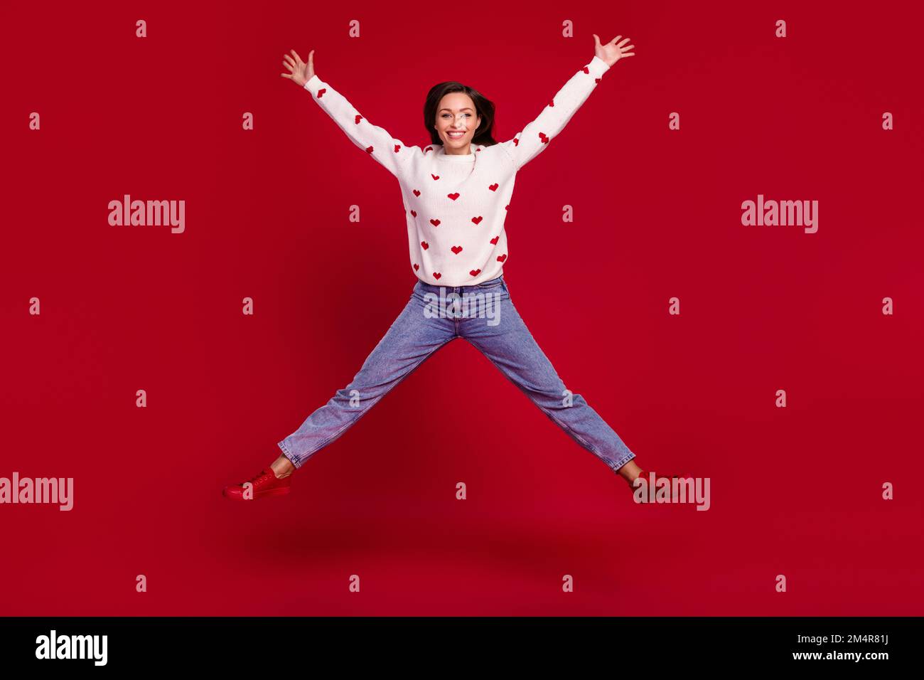 Full length photo of excited pretty girl dressed white pullover jumping ...