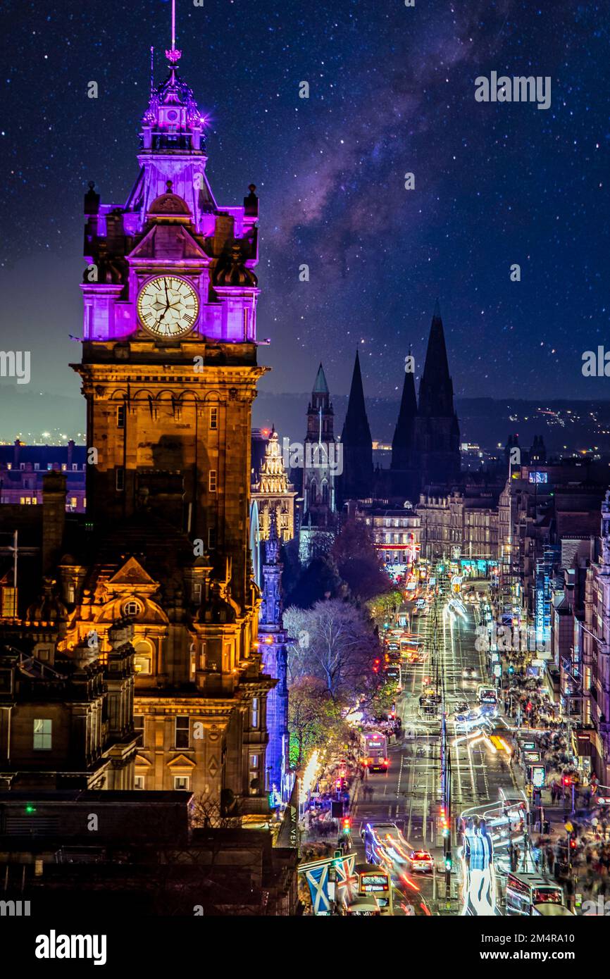 A vertical aerial view of illuminated Edinburgh cityscape with Balmoral ...