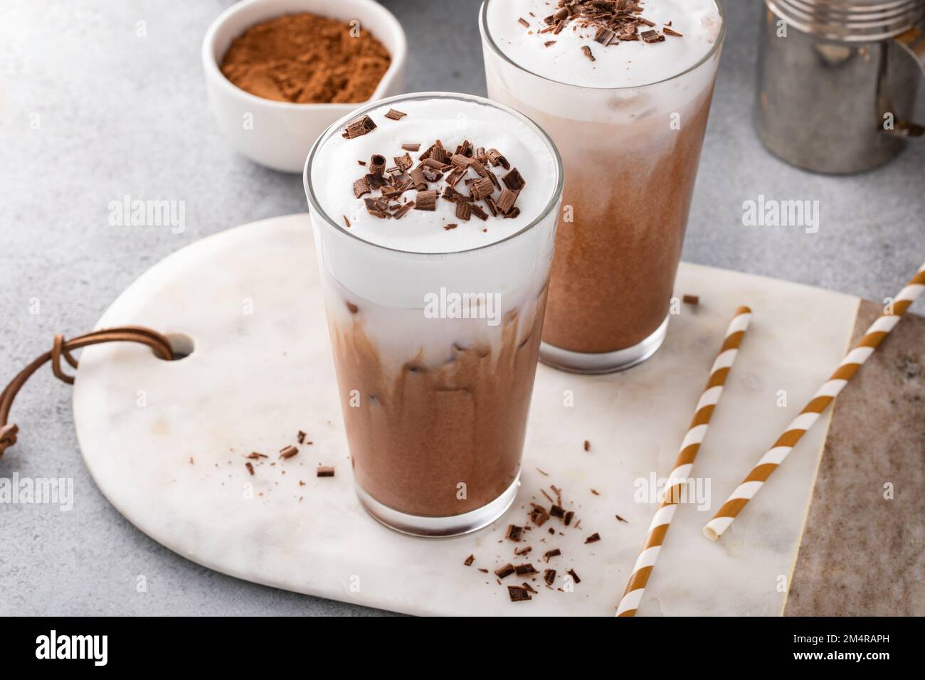 Cold hot chocolate in tall glasses with milk foam Stock Photo - Alamy