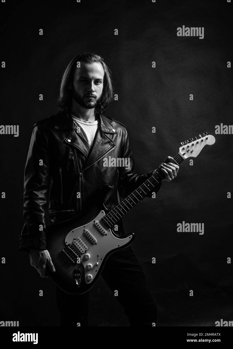 Punk rock guitarist playing electric Black and White Stock Photos ...
