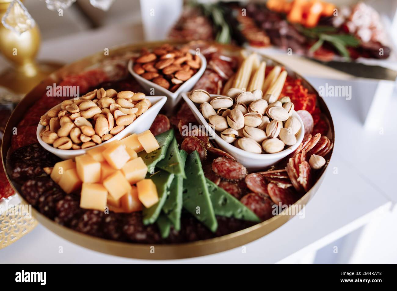 Assorted appetizers table with different antipasti, variations of nuts ...
