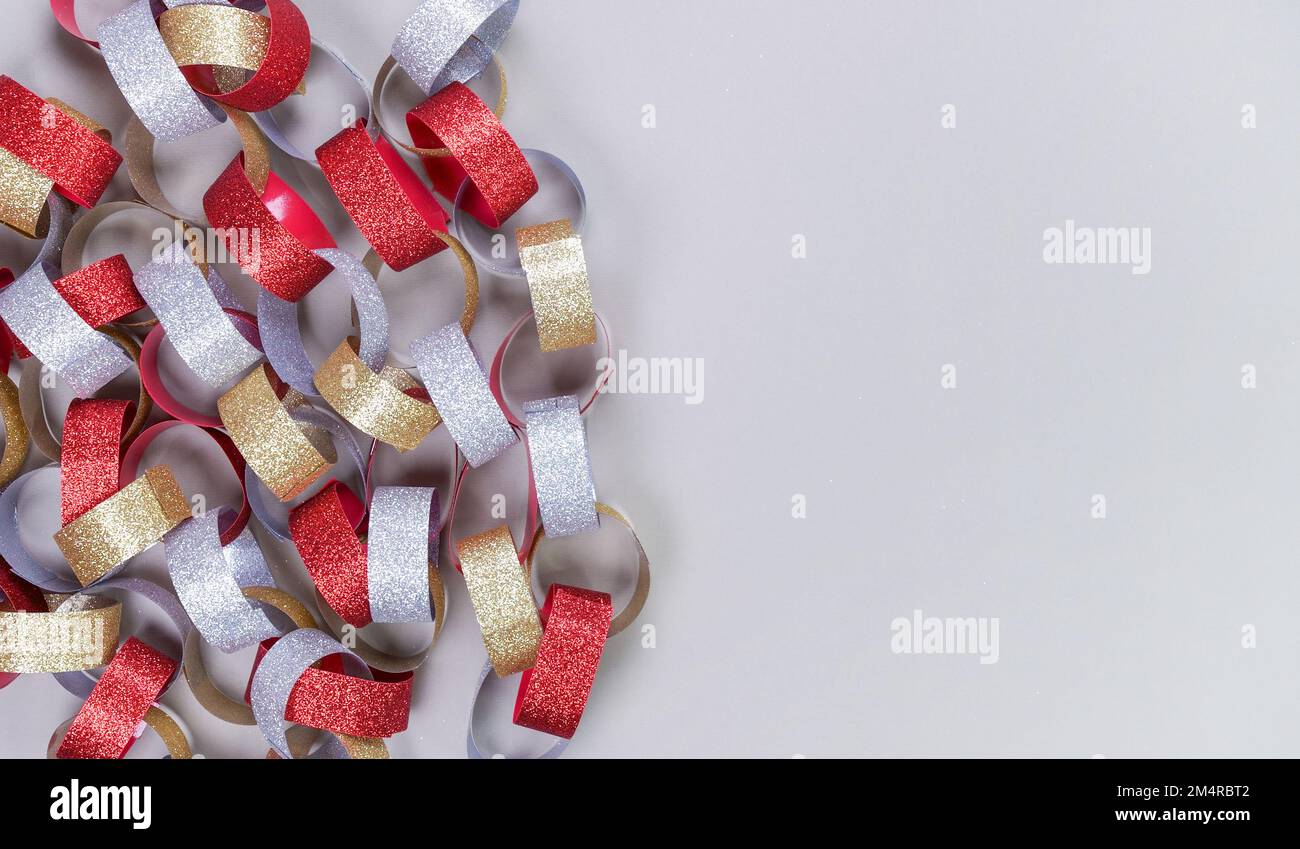 Colorful background with strips of gold silver red sparkling chain ...