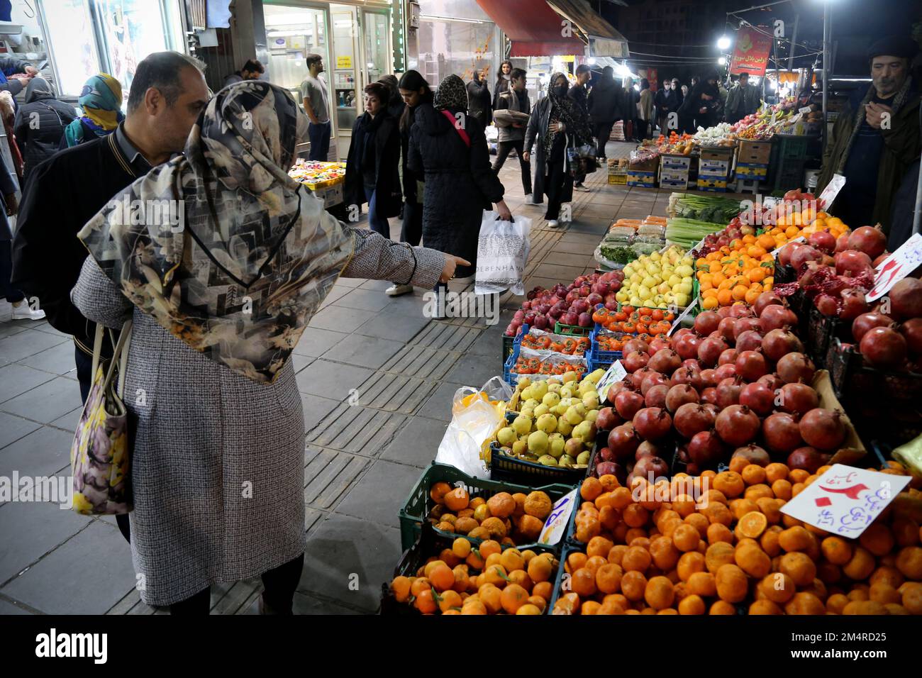 Tehran, Tehran, Iran. 20th Dec, 2022. Iranian shoppers walk past ...