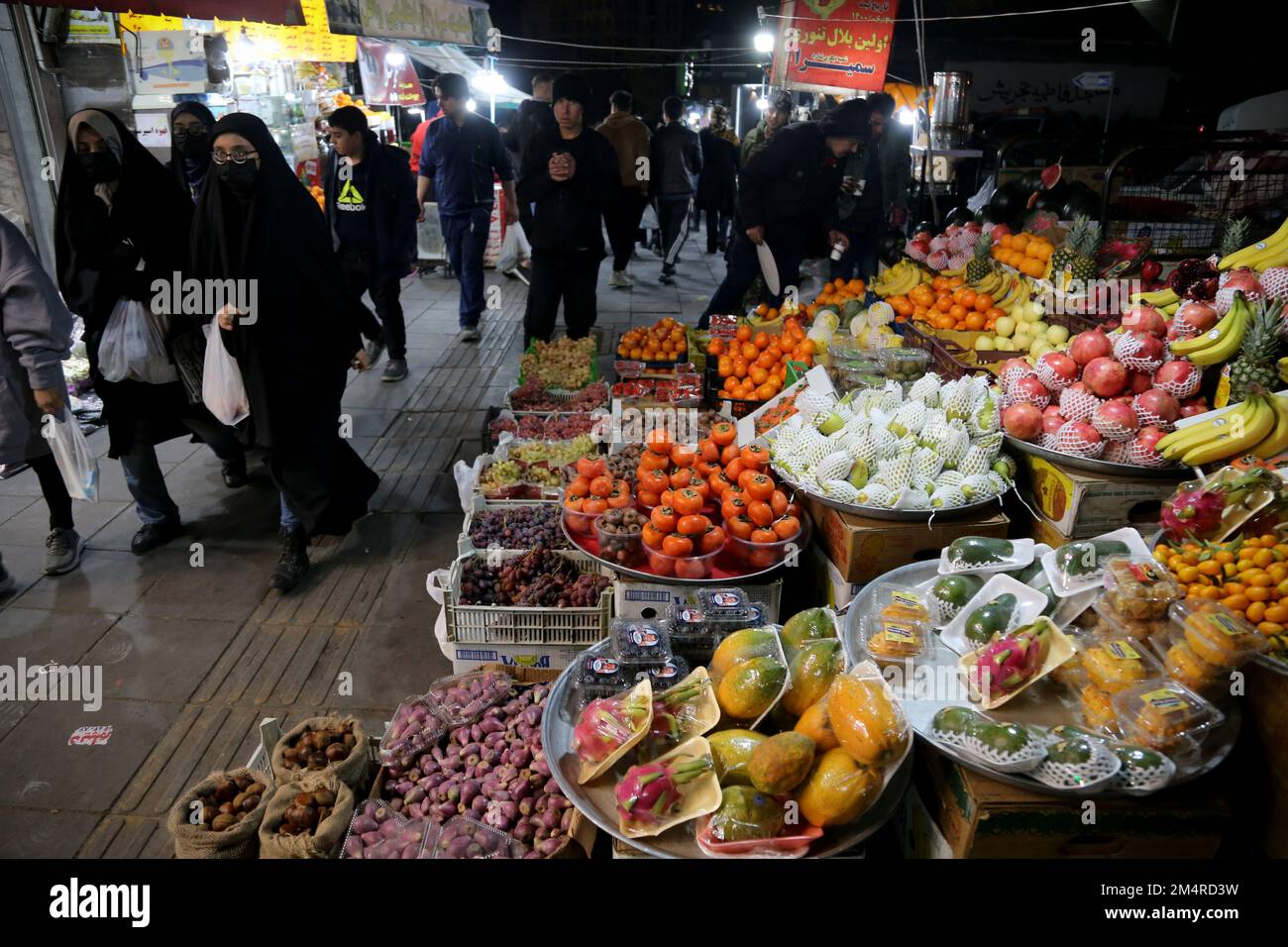 Tehran, Tehran, Iran. 20th Dec, 2022. Iranian shoppers walk past ...