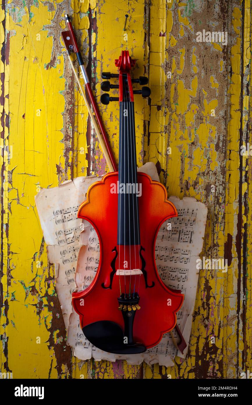 Baroque Violin Hanging On Yellow Wall Still Life Stock Photo - Alamy