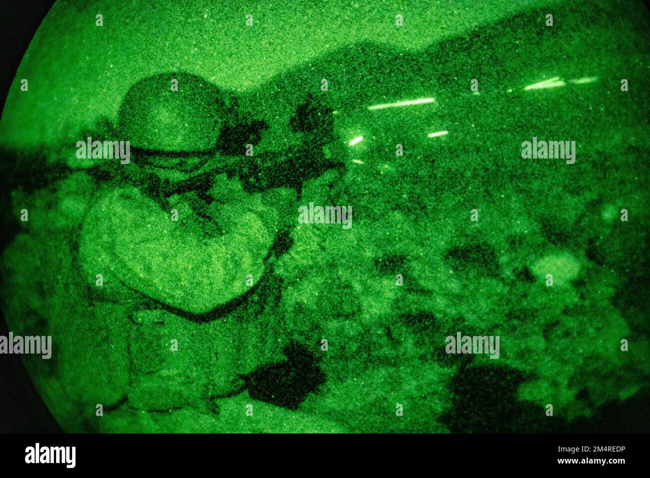 A U.S. Marine with 3rd Battalion, 7th Marine Regiment fires at his ...