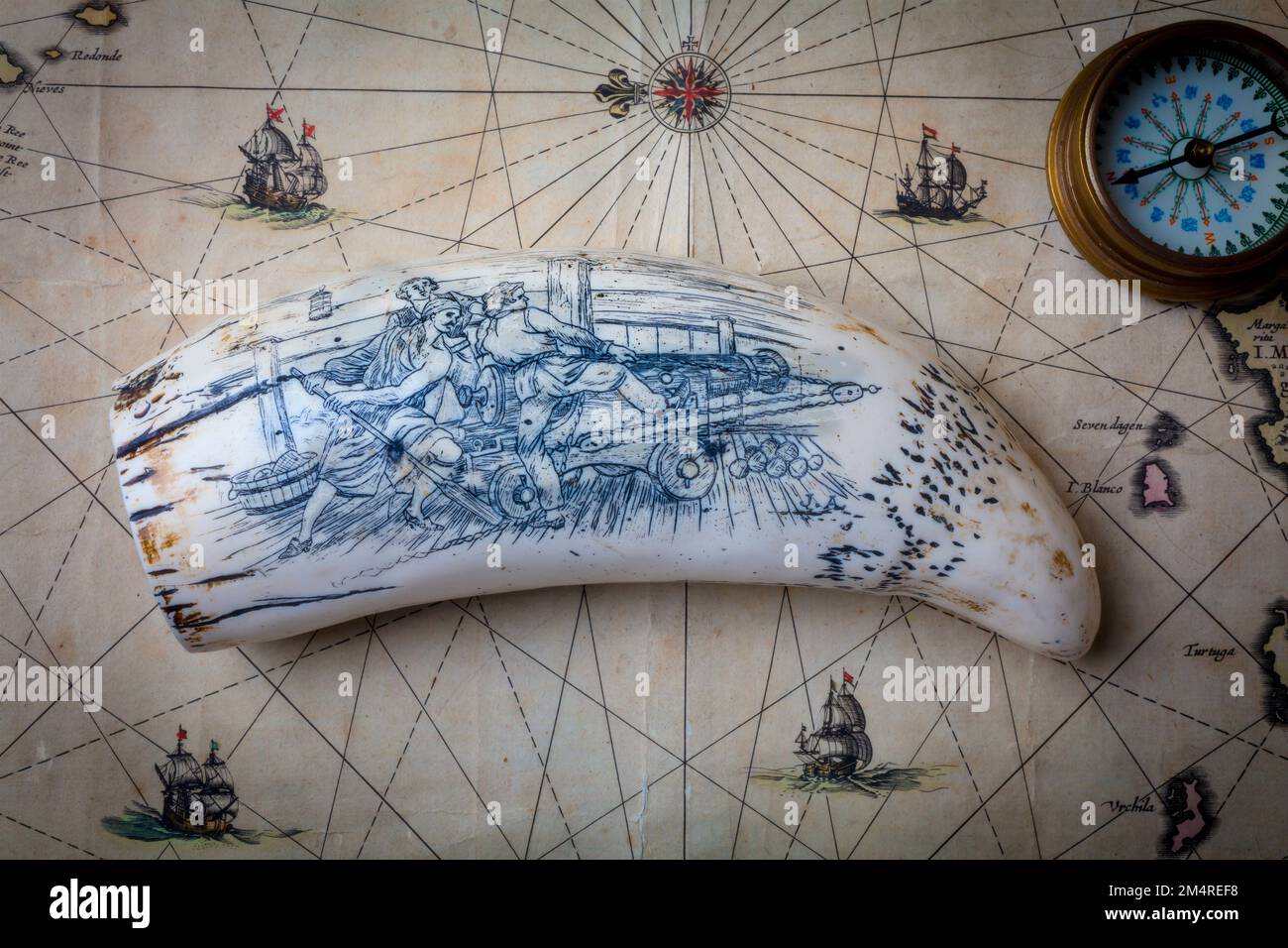 Scrimshaw Ships Canon On Old Map With Compass Stock Photo - Alamy