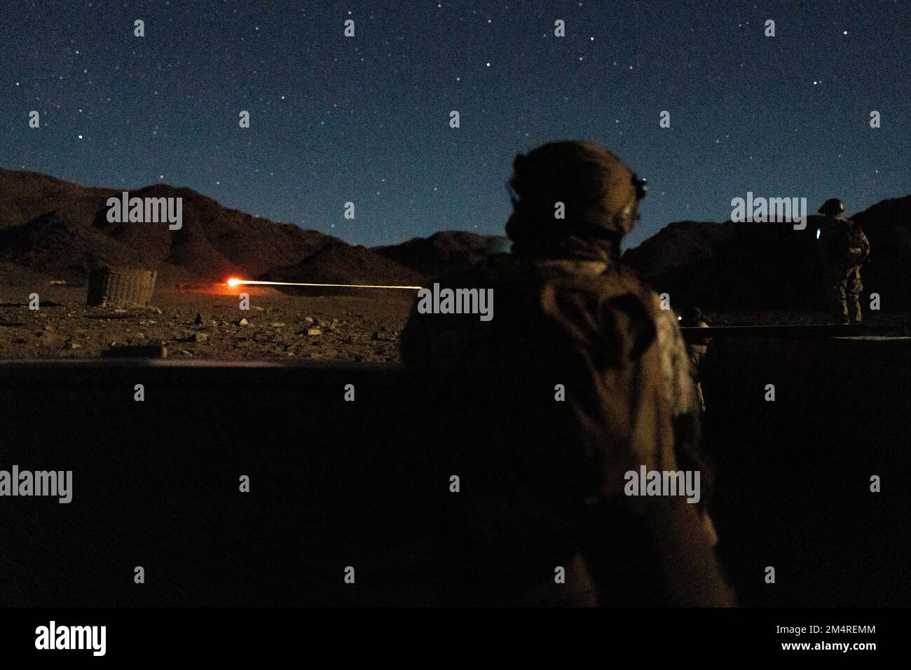 A U.S. Marine with 3rd Battalion, 7th Marine Regiment fires at his ...