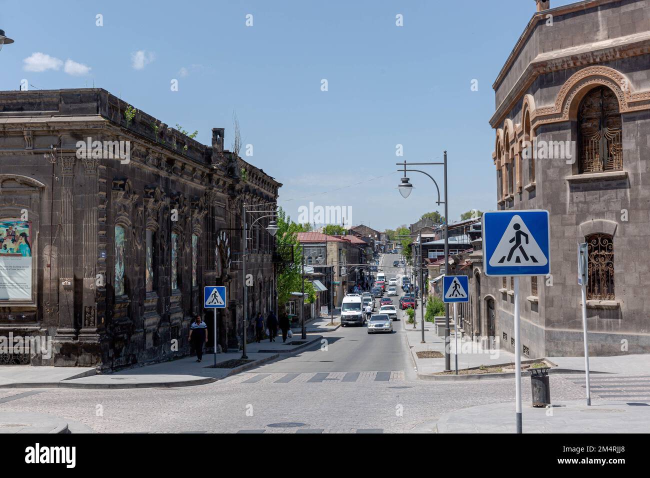 A daytime view of the city life with buildings and transportation in ...