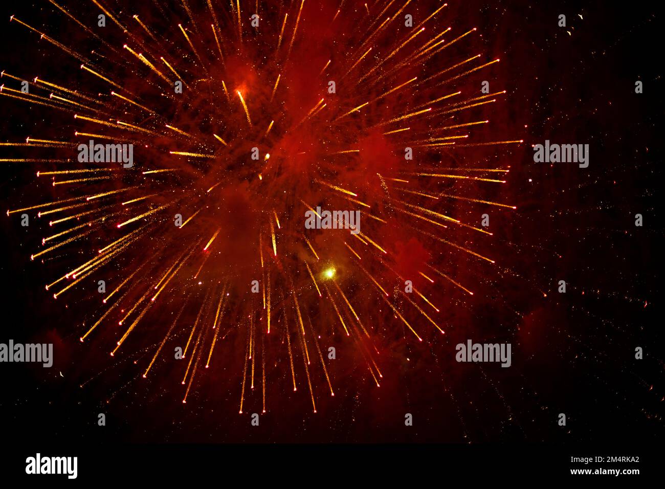 Fireworks in black sky. Explosions of pyrotechnics on holiday. Sparks ...