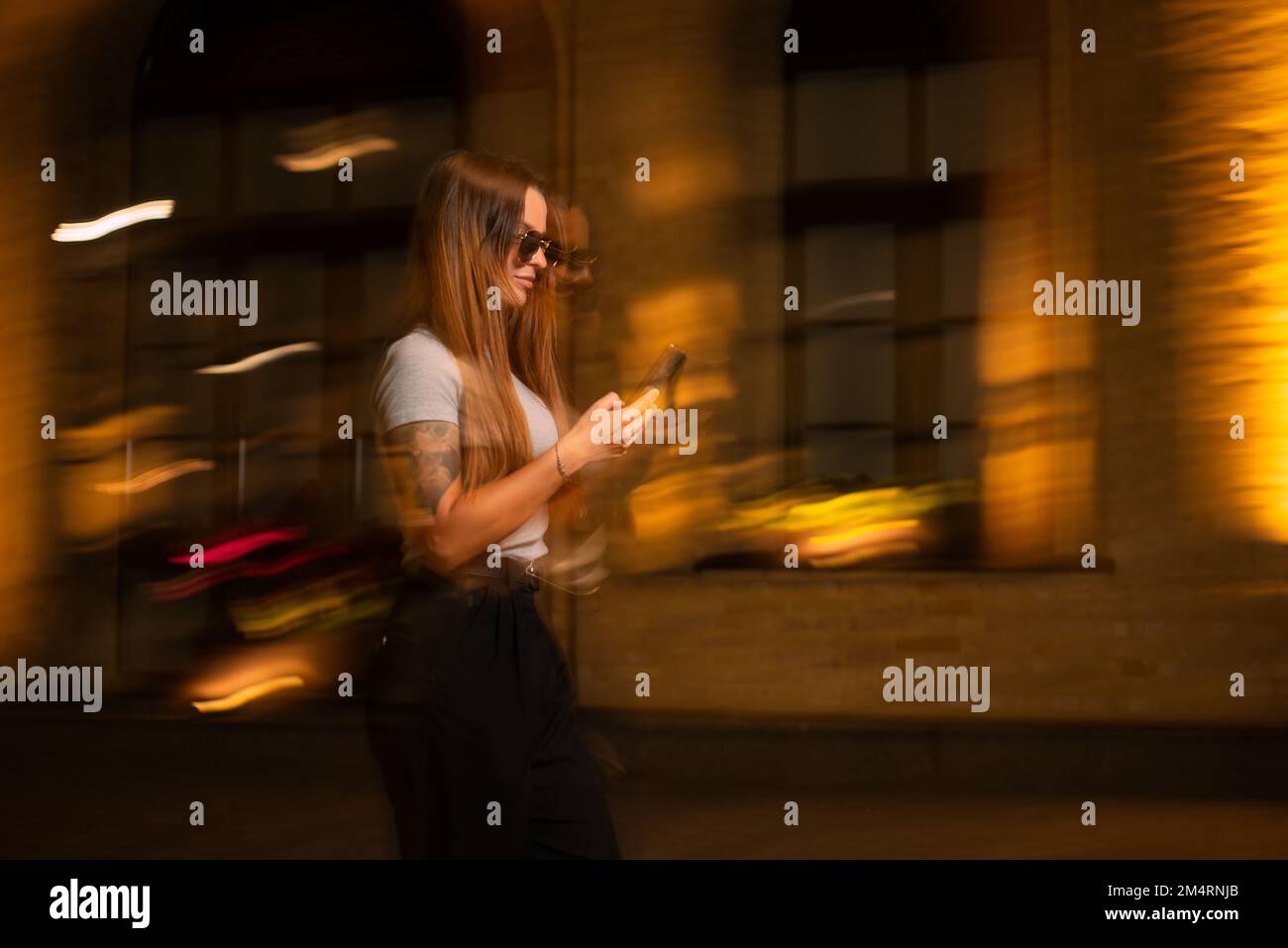 Motion blur portrait a contemporary young fashionable woman wearing ...