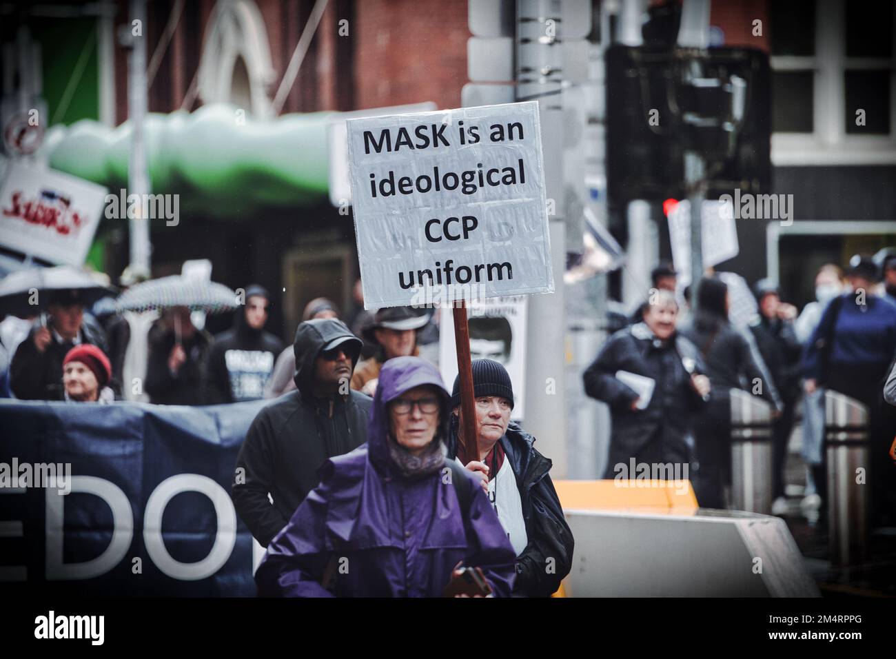 An aerial view of people carrying signs in a freedom protest in in ...