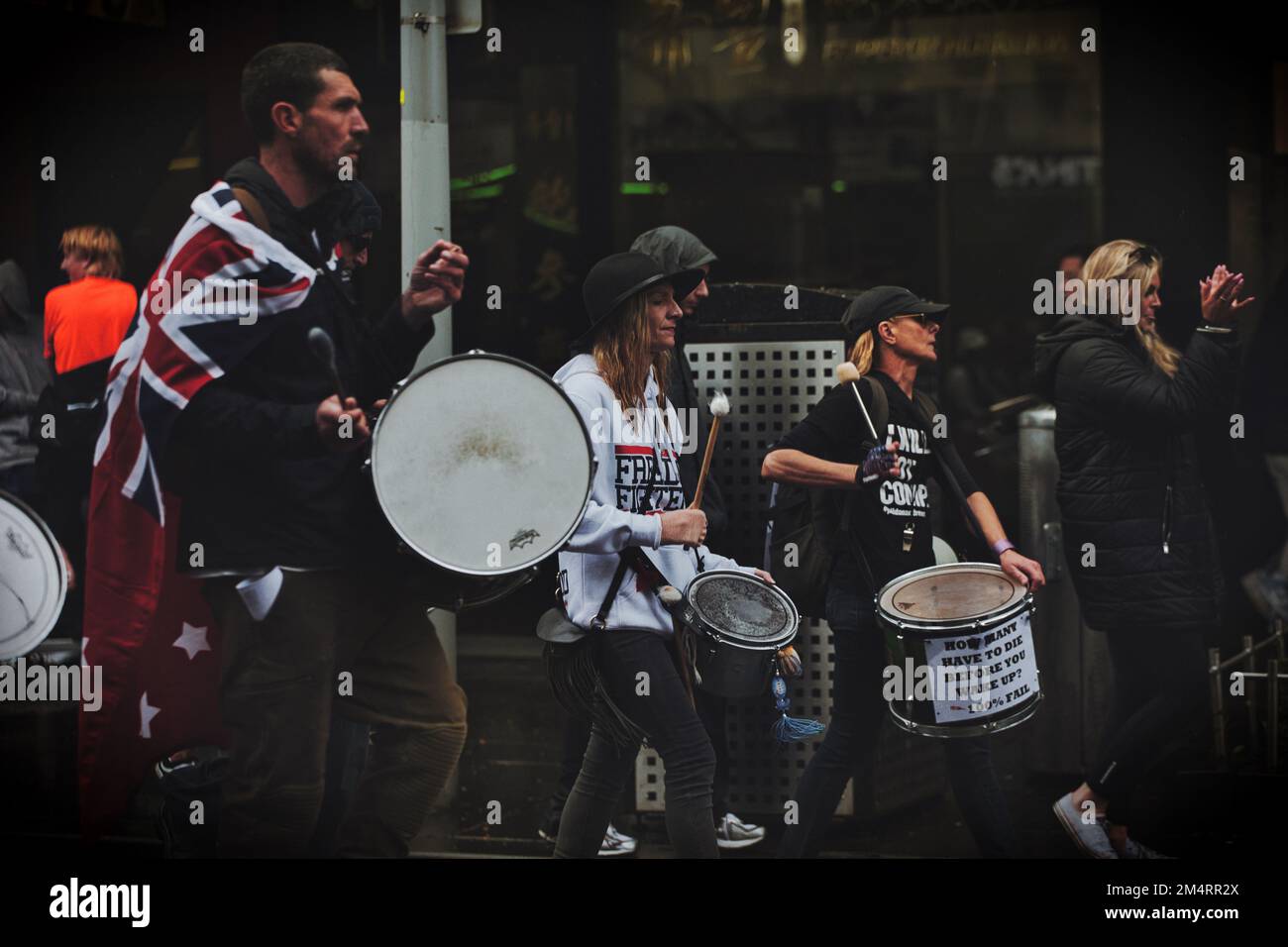 A drummer playing in a freedom protest in Melbourne Stock Photo - Alamy