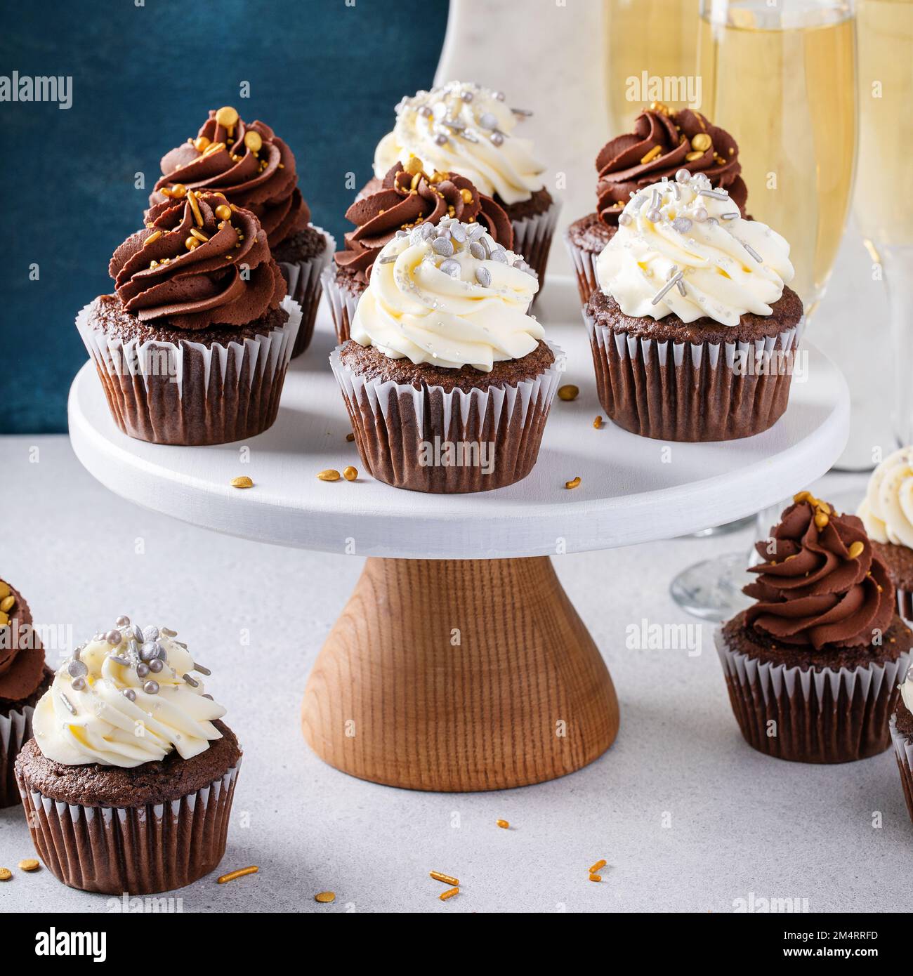 New Years eve cupcakes with festive sprinkles served with champagne ...