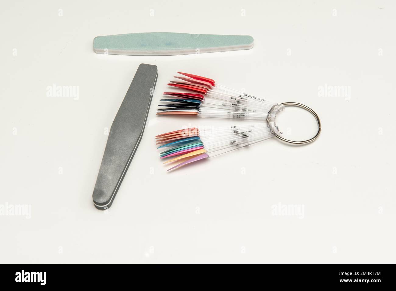 A color chart for choosing decorative nail polishes and files used for ...