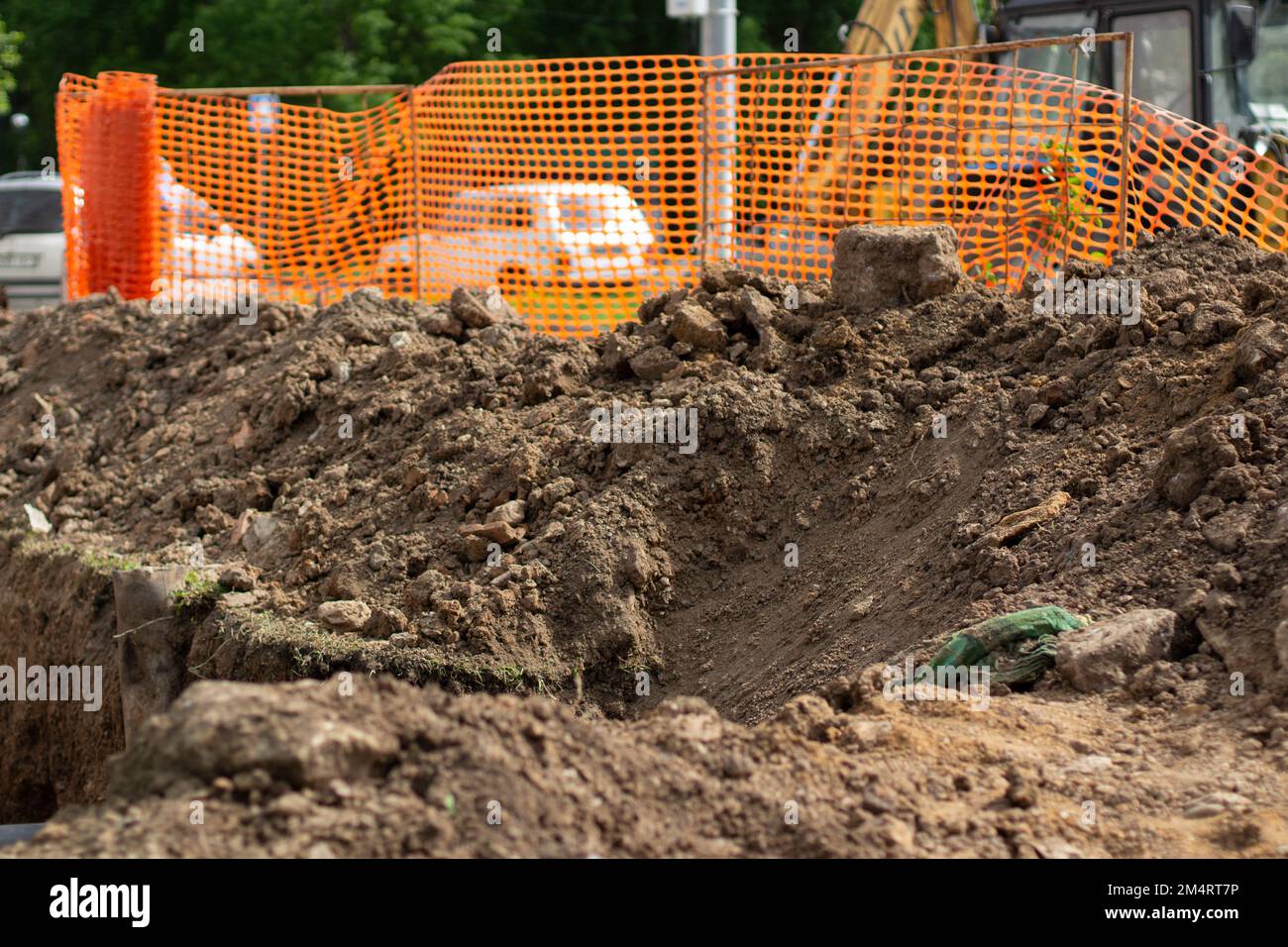 Excavated soil at construction site. Laying pipes in city. Excavated ...