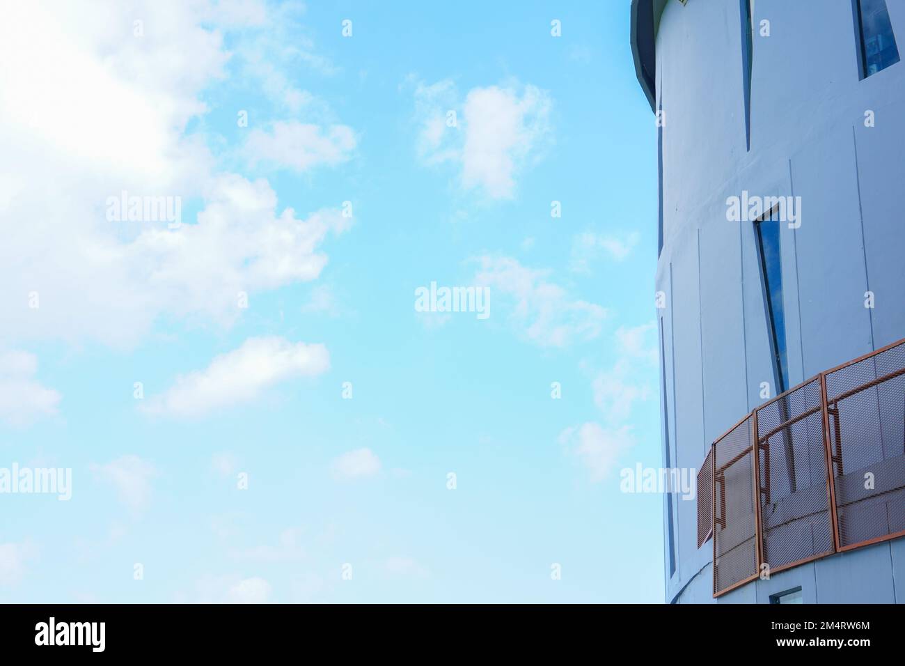 The concept of a building with a unique triangular window with a bright ...