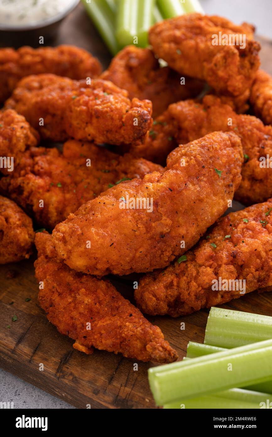 Buffalo chicken fingers served with ranch sauce and celery Stock Photo ...