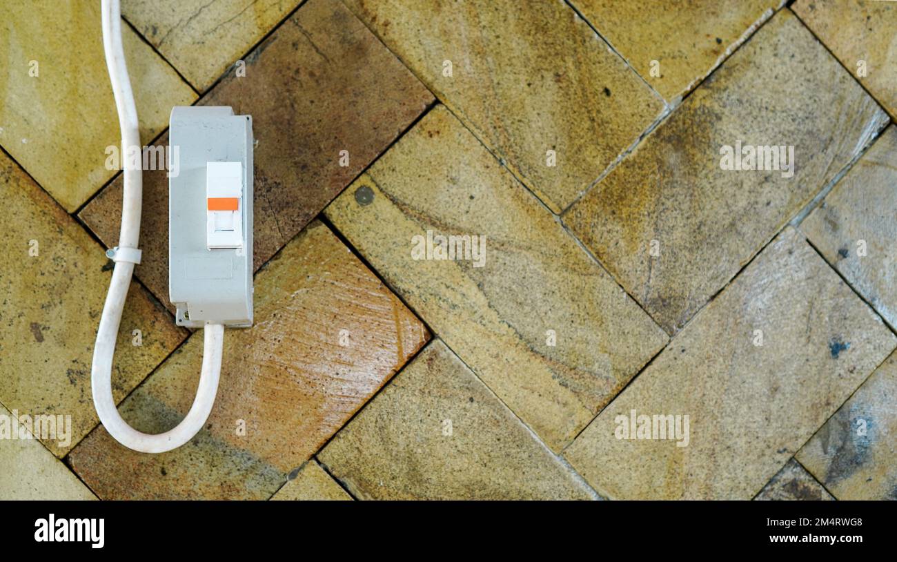 Electric fuse for household with natural stone wall background ...